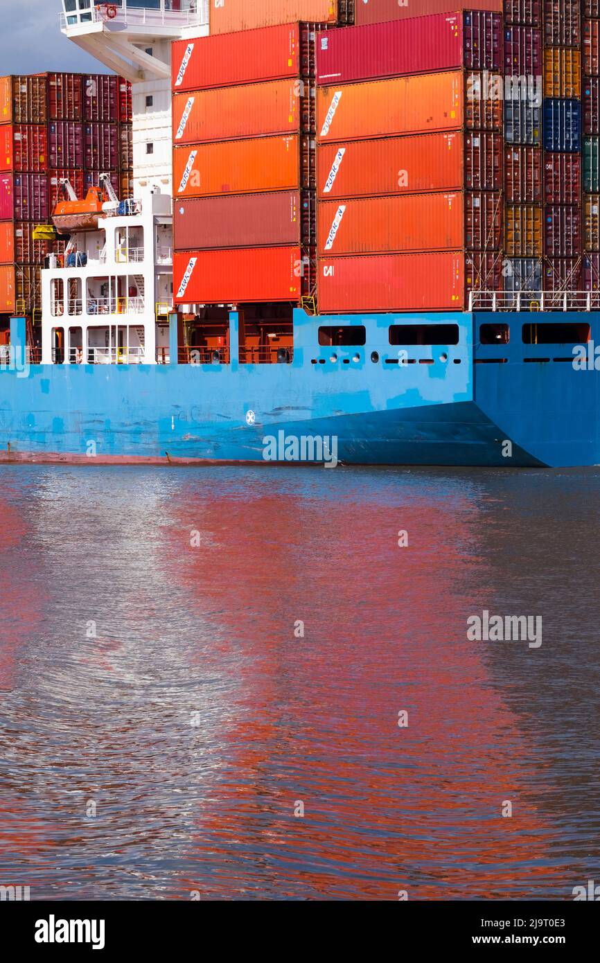 USA, Georgia, Savannah. Container ship with reflections entering ...