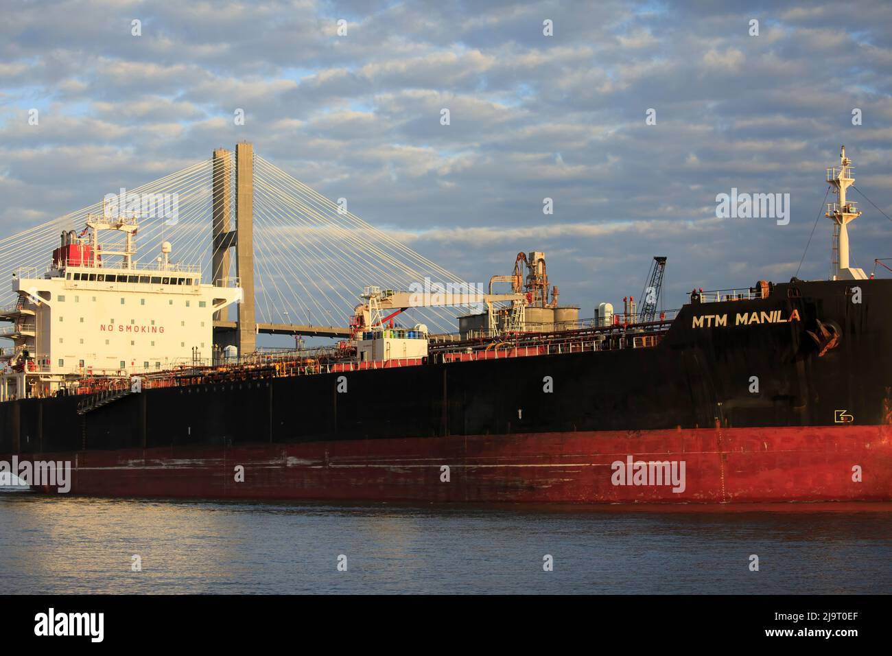 USA, Georgia, Savannah. Tanker ship with reflections leaving Savannah ...
