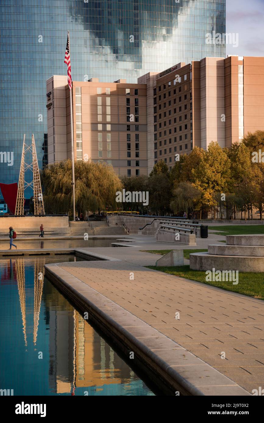 Glass building facade, reflection in water, White River State Park ...