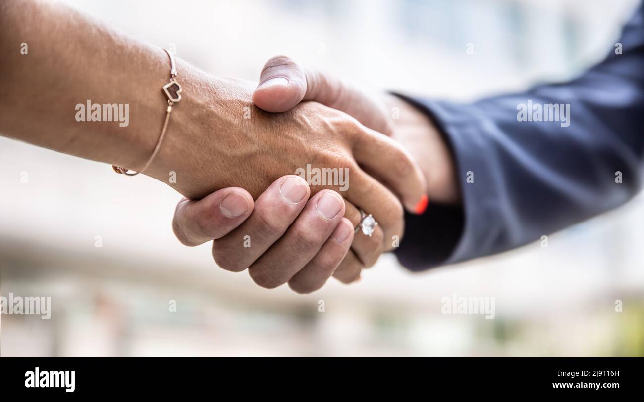 Detail of a professional handshake of a male and female hand Stock ...