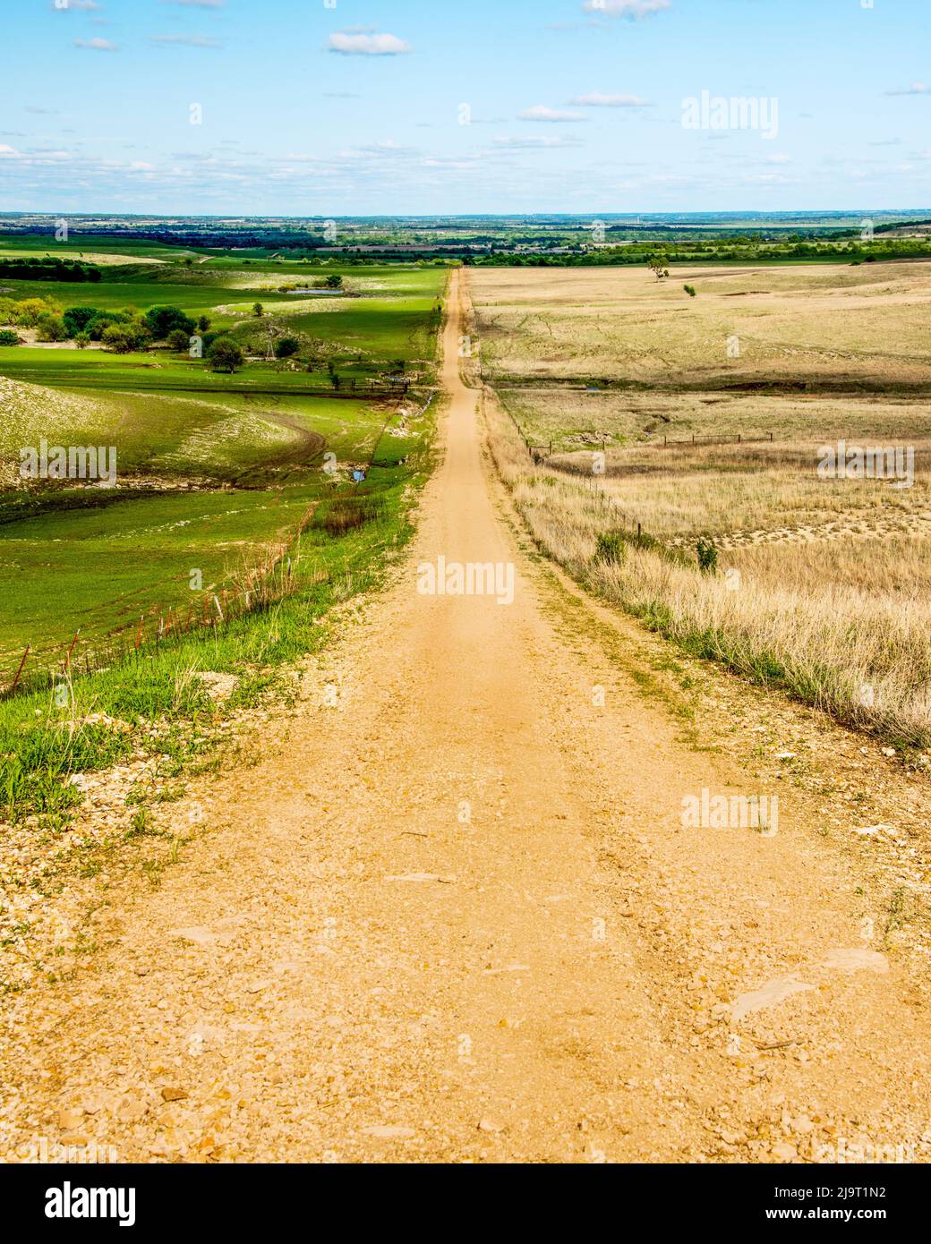 Road in the Flint Hills, dividing two colors of grass Stock Photo - Alamy
