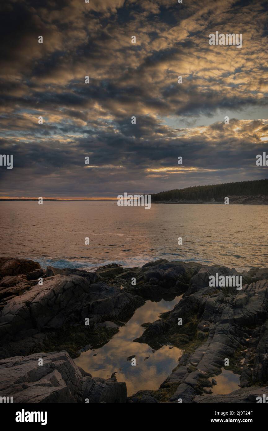 USA, Maine, Acadia National Park. Moody sunset on ocean coastline Stock ...