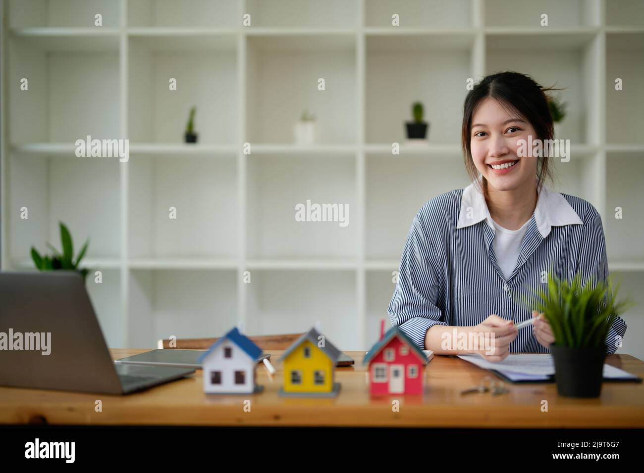 Portrait real estate agent working with contract agreement on workplace ...