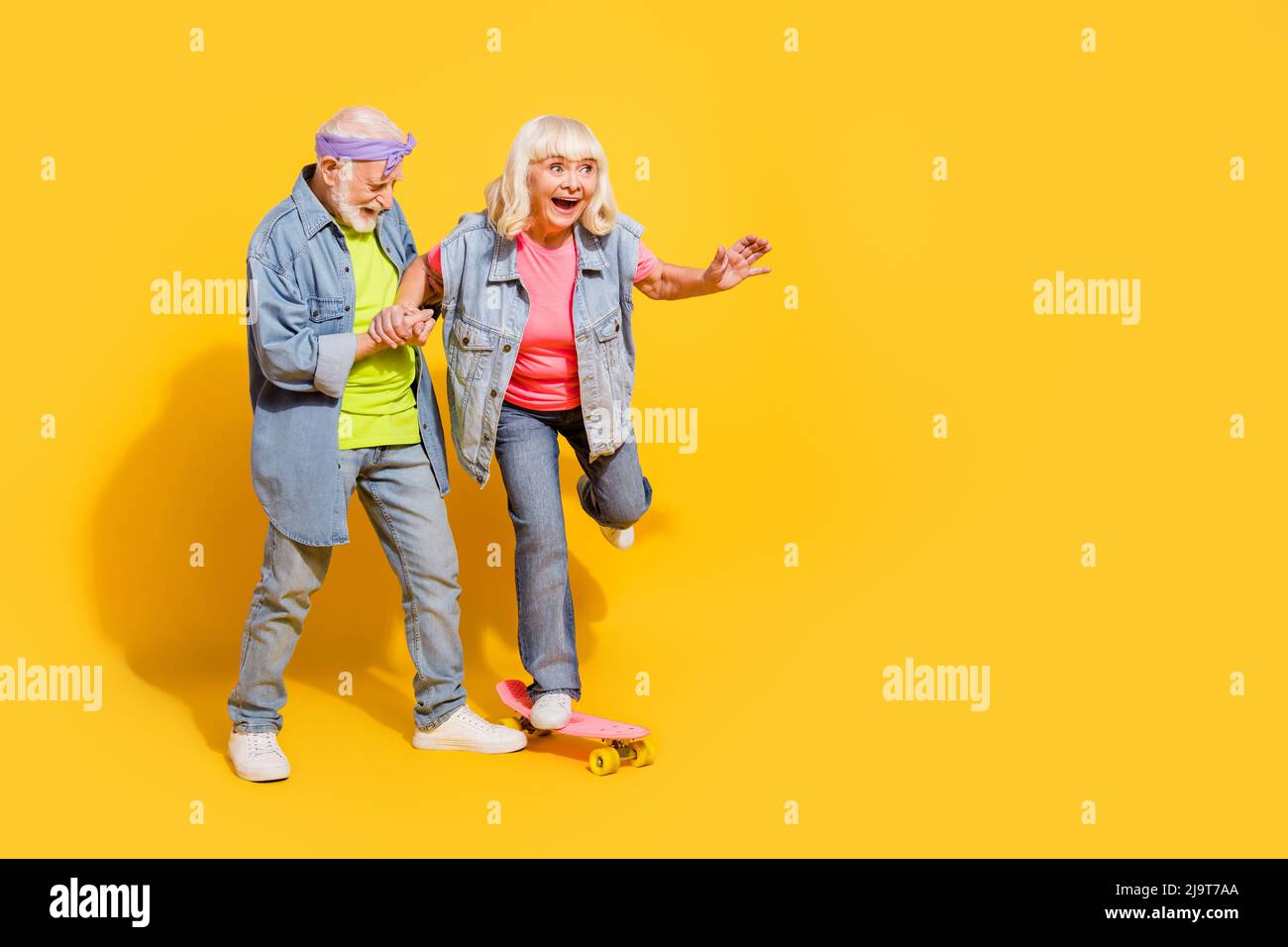 Photo of shiny funky girlfriend boyfriend dressed denim learning riding ...