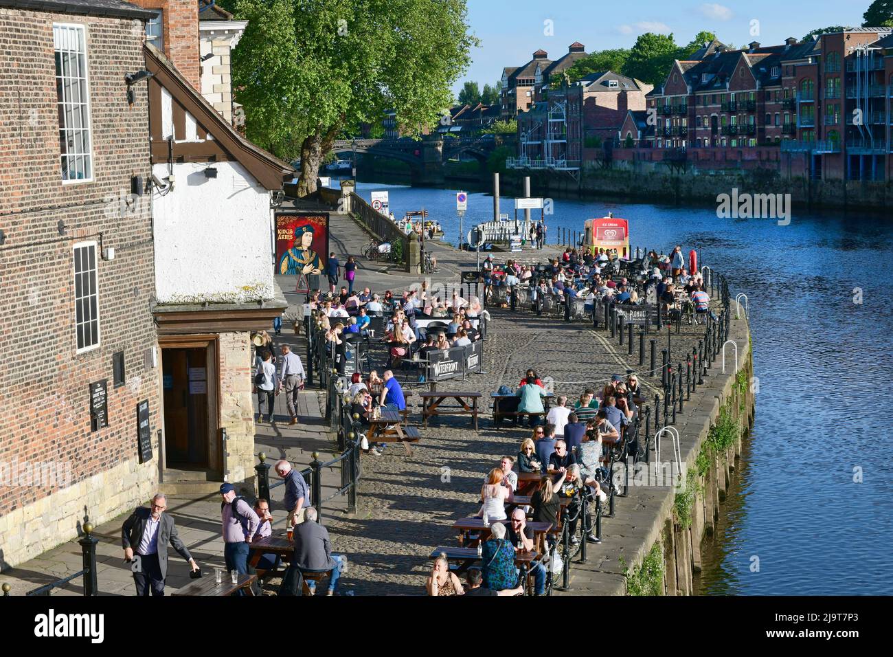 people enjoying warm sunny weather outside the kings arms pub by the ...