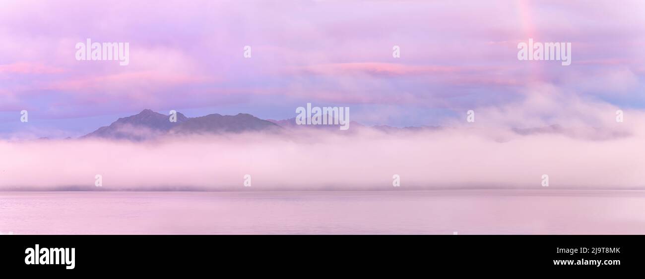 USA, Washington State, Seabeck. Rainbow sunrise panoramic over Hood ...