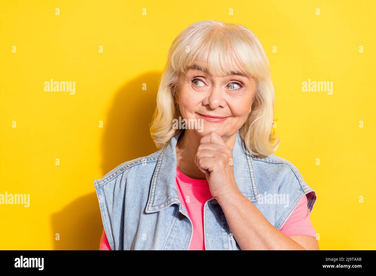 Photo of sweet thoughtful lady pensioner dressed denim waistcoat arm ...