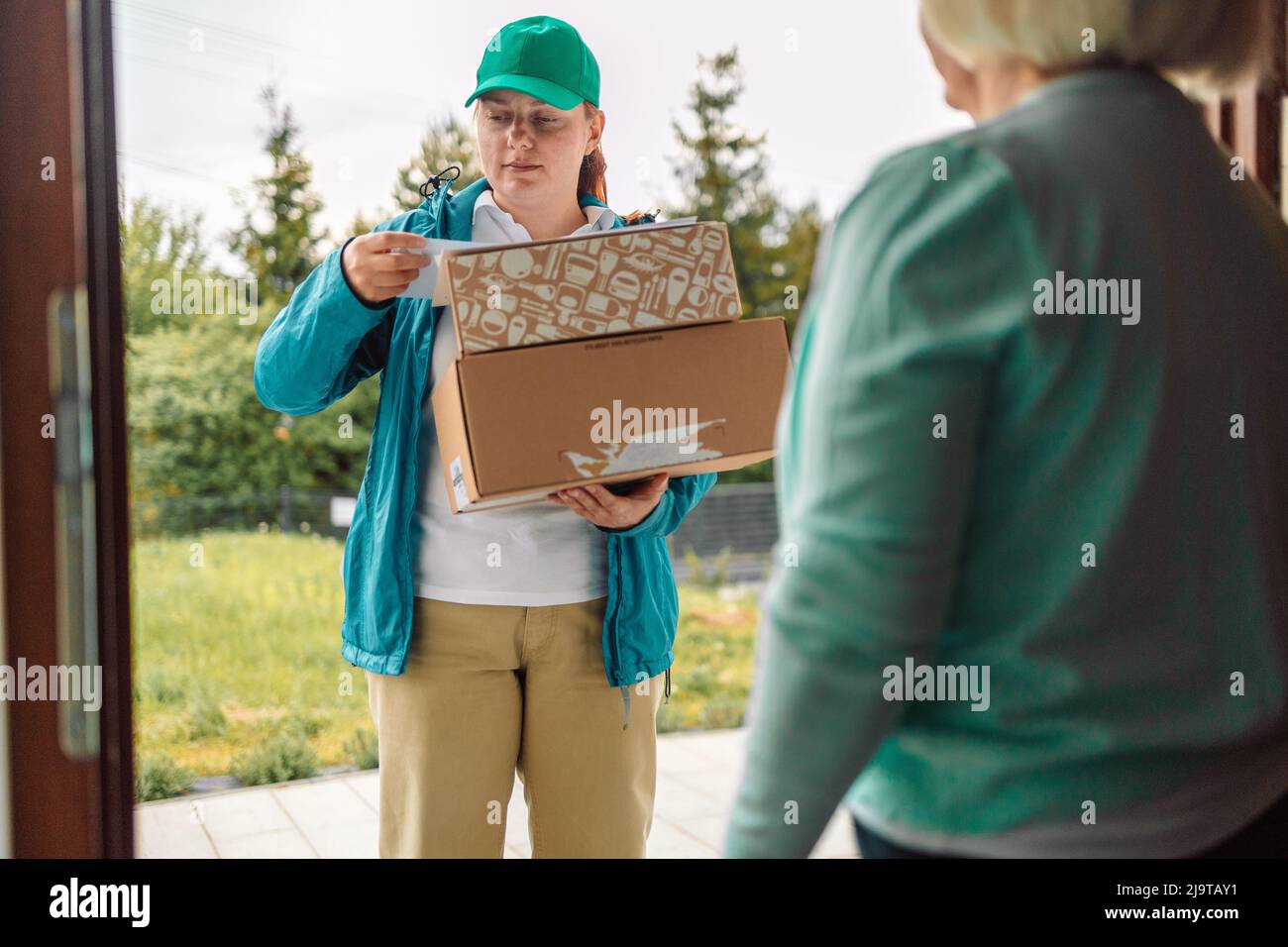 Postal service sending paper cardboard box to customer in front of a ...