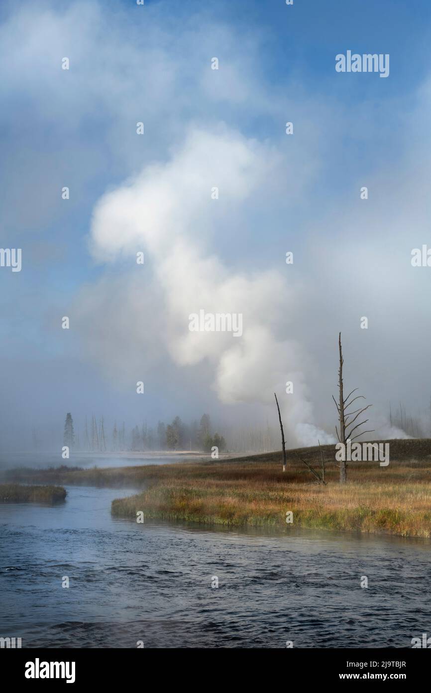 Fog and geyser steam along the Firehole River, Yellowstone National ...