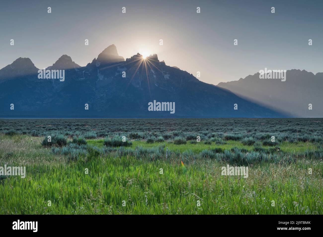 Setting sun behind the Teton Range from Antelope Flats. Grand Teton ...