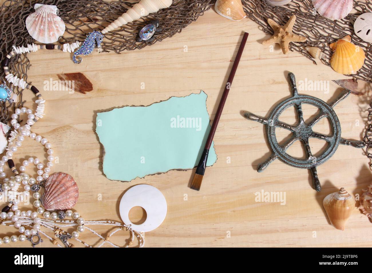 Blank Paper With Burned Edges on Wood Background With Sea Shells and ...