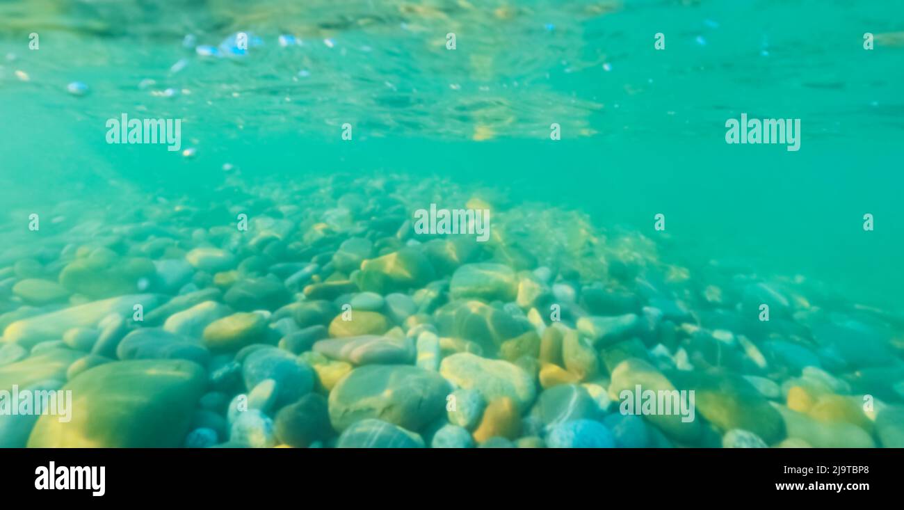 Sea rocky bottom in turquoise shallow water. Underwater photography ...