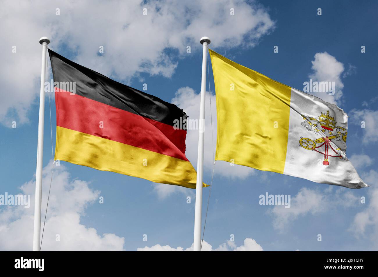 Germany and Vatican City two flags on flagpoles and blue cloudy sky ...