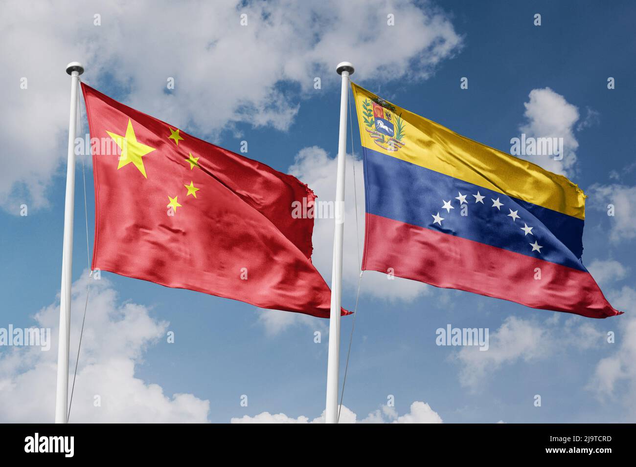 China and Venezuela two flags on flagpoles and blue cloudy sky ...