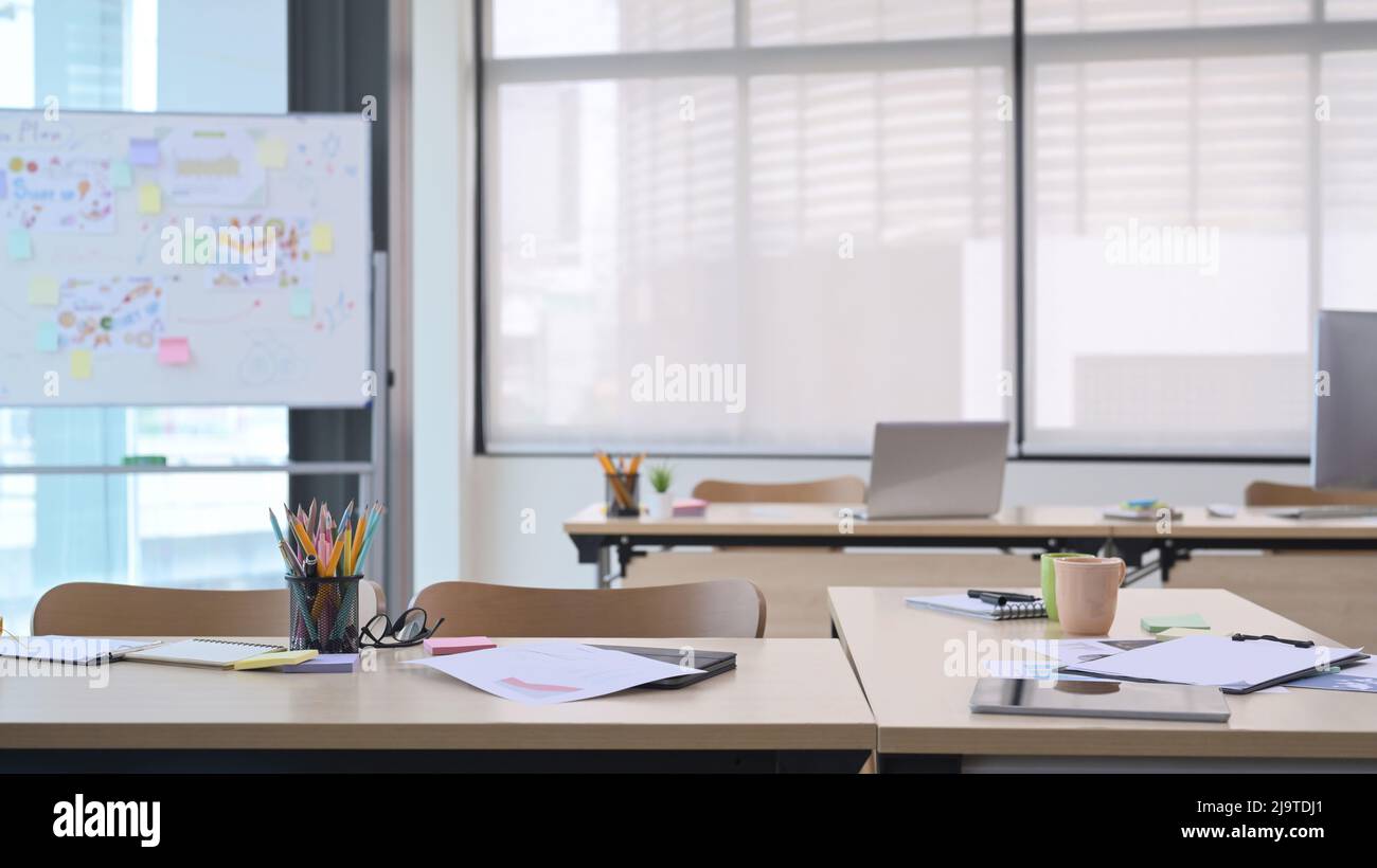 Startup business office interior with tables, chairs and laptop ...