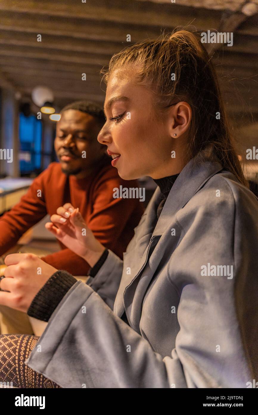 Attractive and beautiful girl is thinking while guessing the word Stock ...