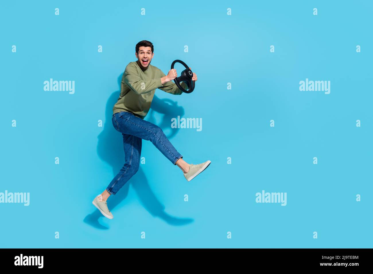 Full length photo of funky millnnial brunet guy run drive wear shirt ...