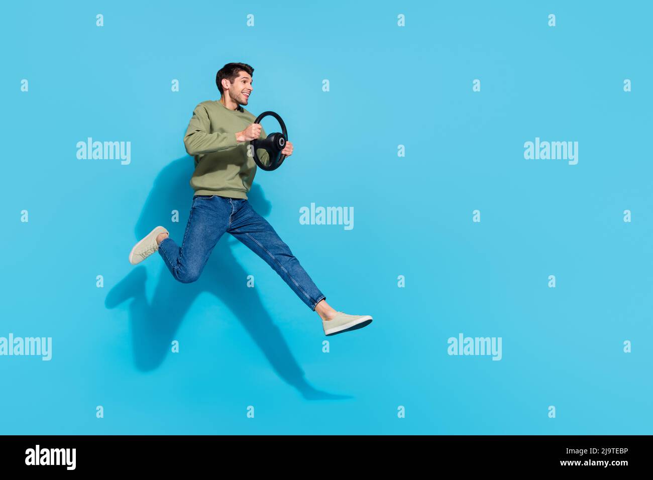 Full size photo of funny millennial brunet guy drive car look promo ...