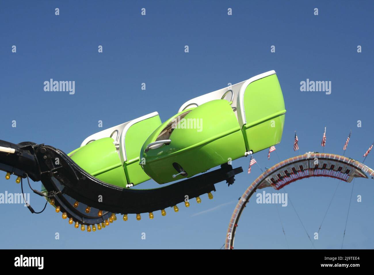 County Fair Carnival Rides with American Flags and Blue Sky Stock Photo ...