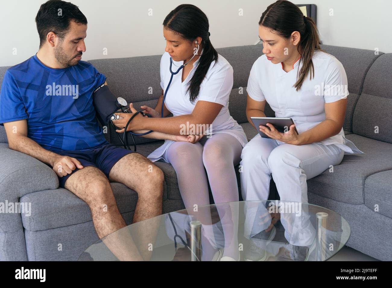 Nurses check Patient's Blood Pressure Stock Photo - Alamy
