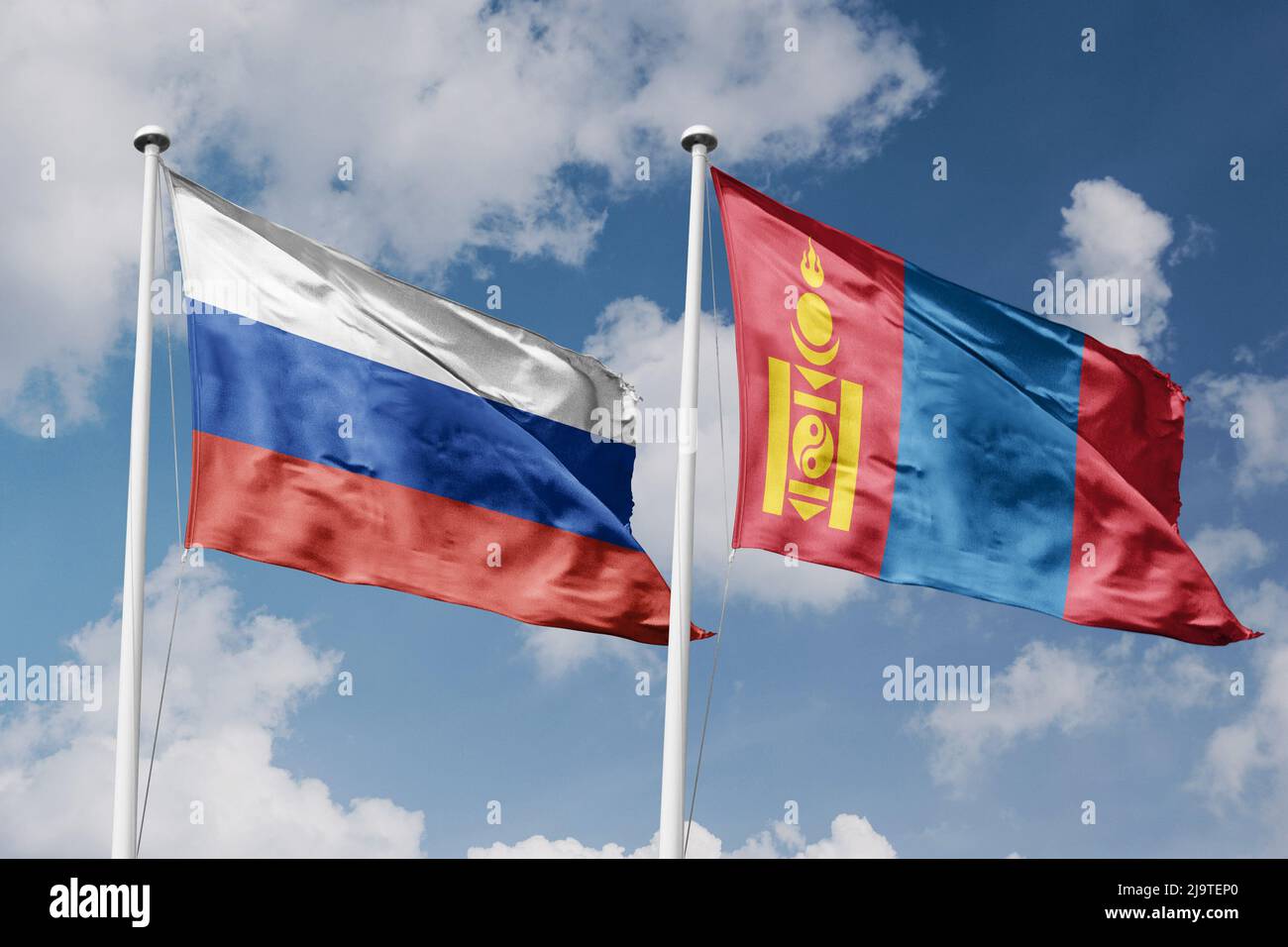 Russia and Mongolia two flags on flagpoles and blue cloudy sky ...