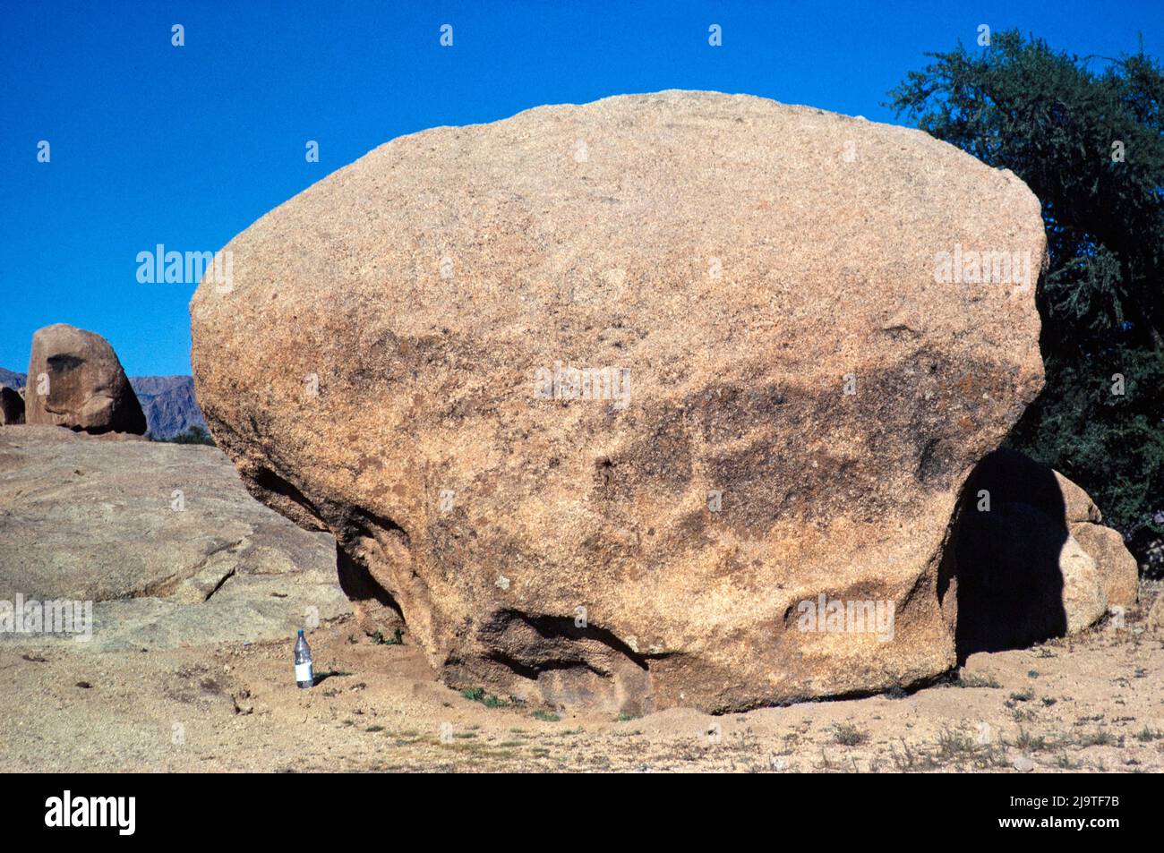 Wind erosion and weathering of large granite block in desert area of ...
