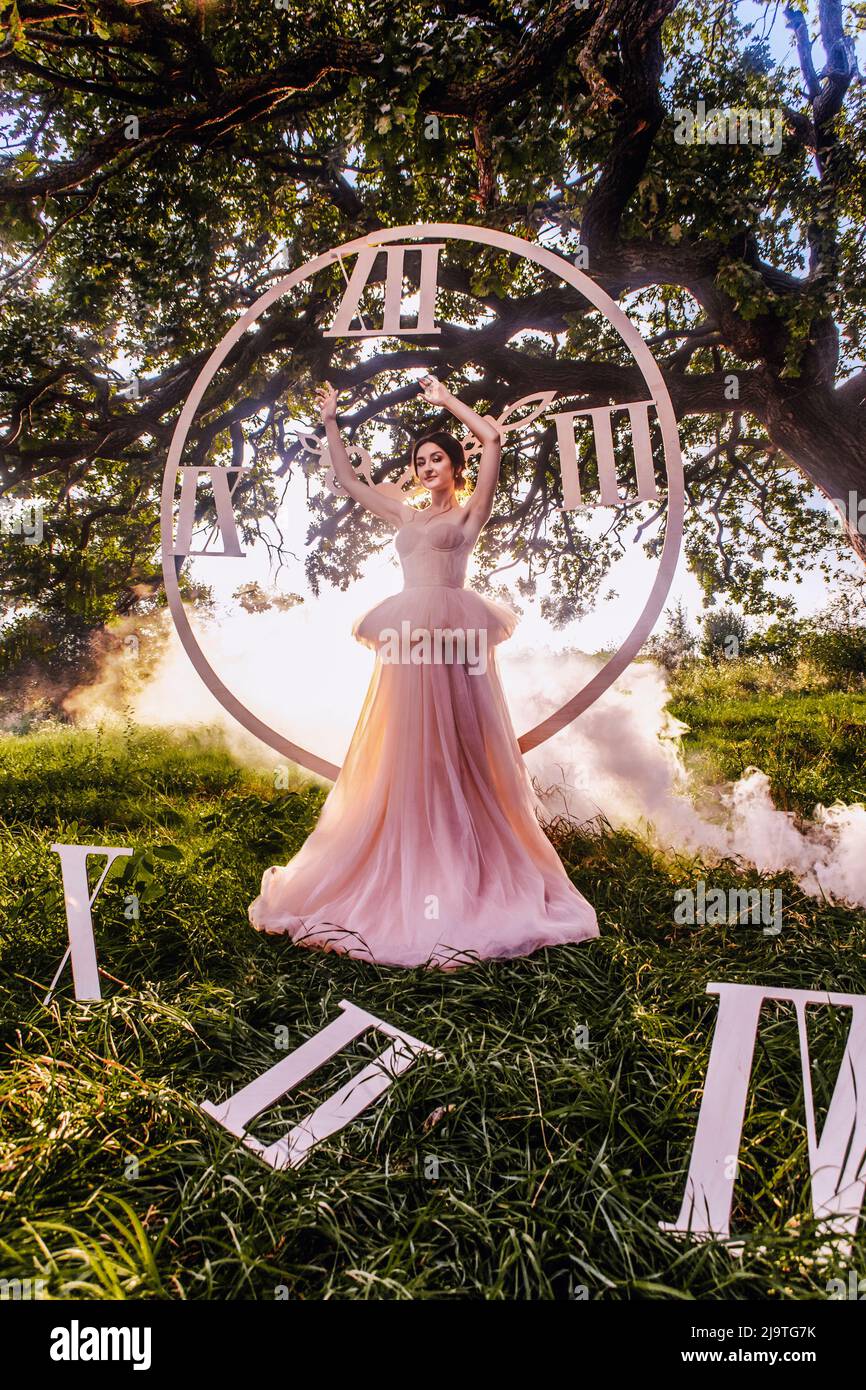 Woman with big clocks hi-res stock photography and images - Alamy