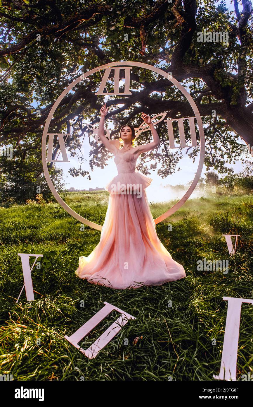 Woman with big clocks hi-res stock photography and images - Alamy