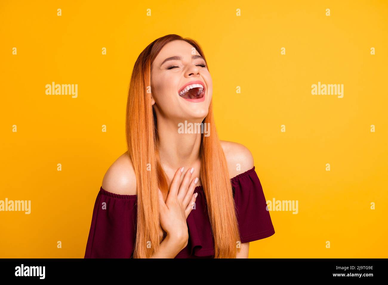Photo of satisfied young lady closed eyes hand touch chest laughing ...
