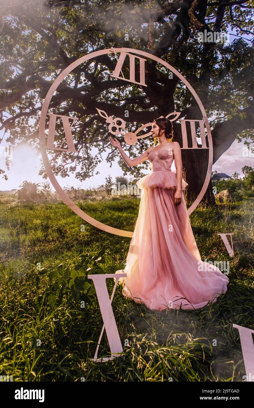 Woman with big clocks hi-res stock photography and images - Alamy