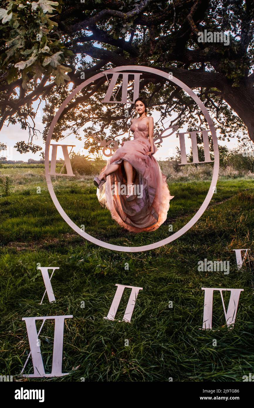 Woman with big clocks hi-res stock photography and images - Alamy