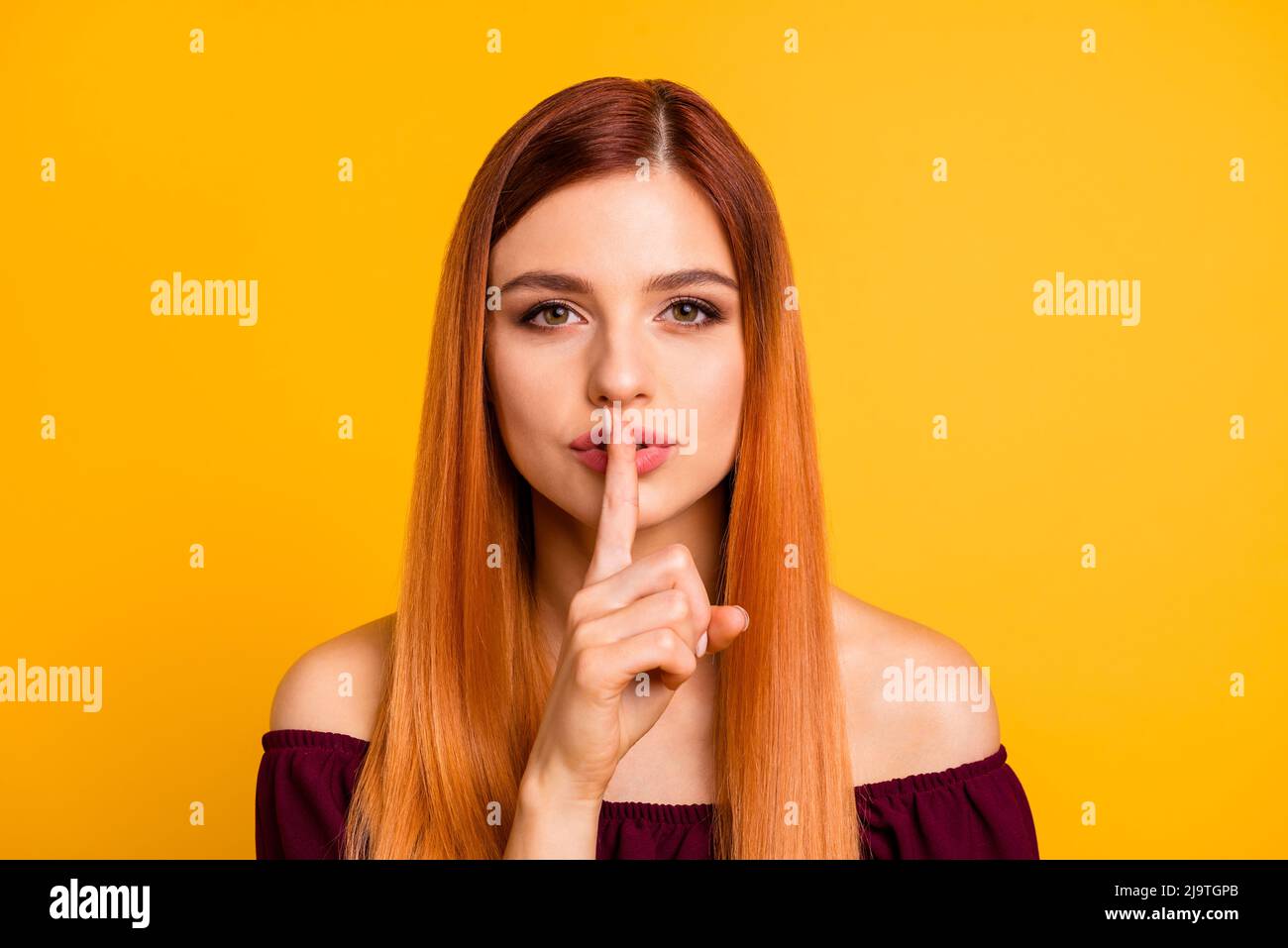 Portrait of young person finger touch lips show do not tell gesture ...
