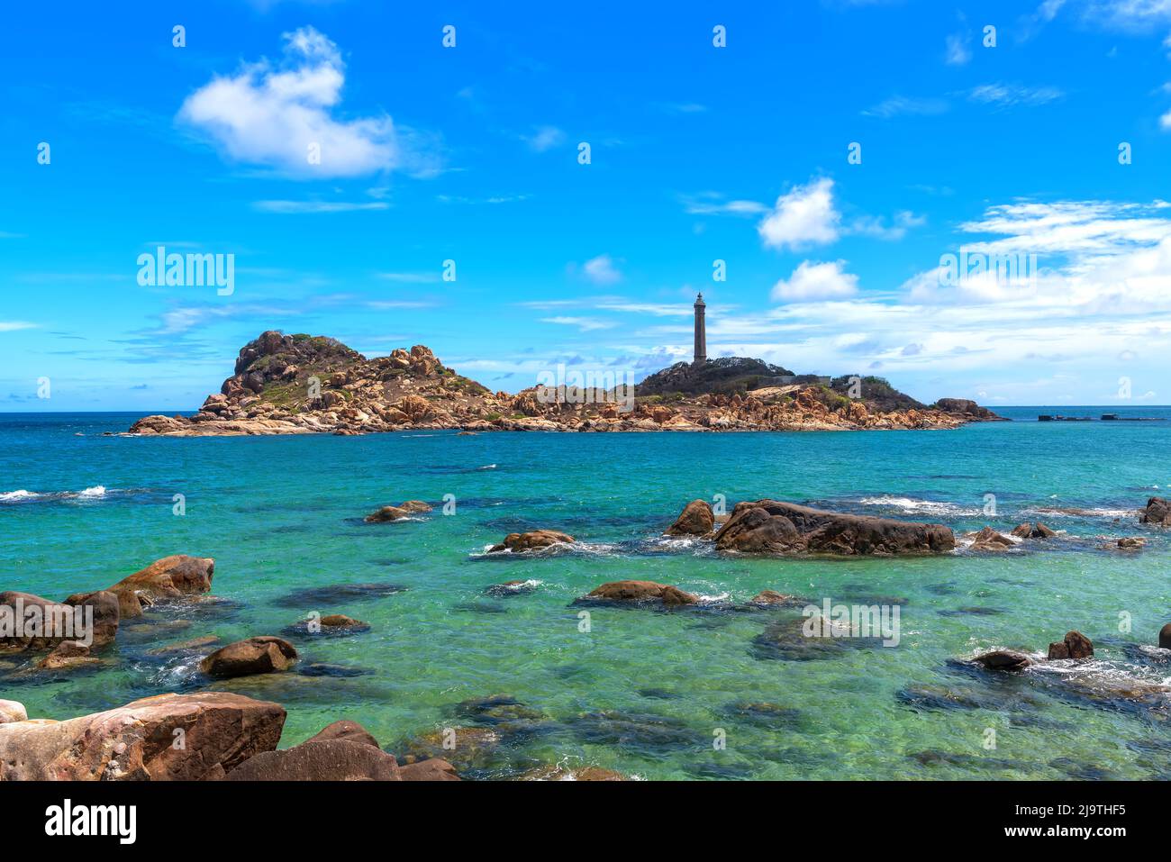 Ke Ga lighthouse is located on an island near the shore seen from above ...