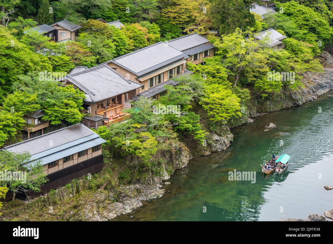 Traditional japanese style wooden houses in the mountains with river ...