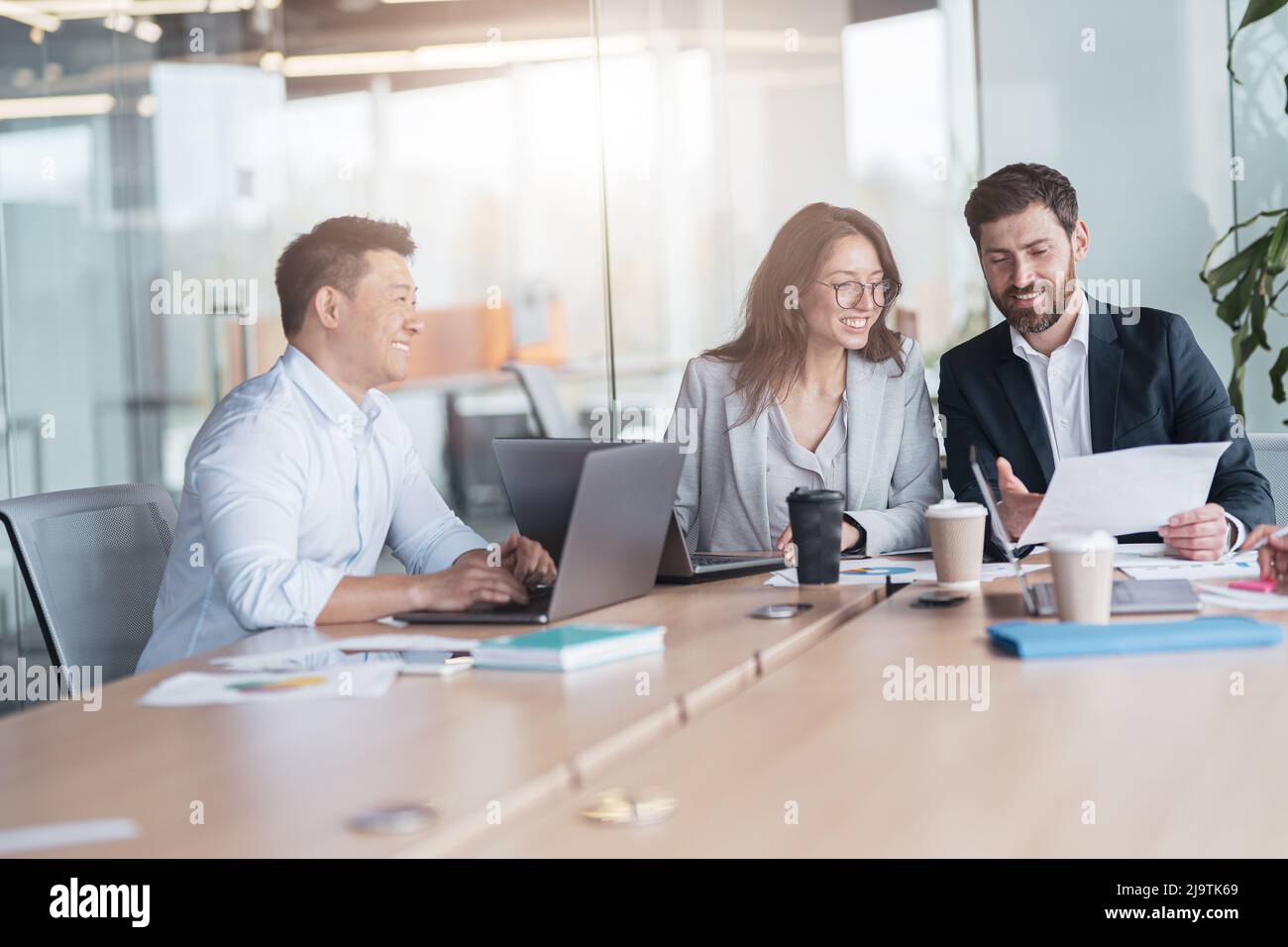 Creative business team working on project in modern office with ...