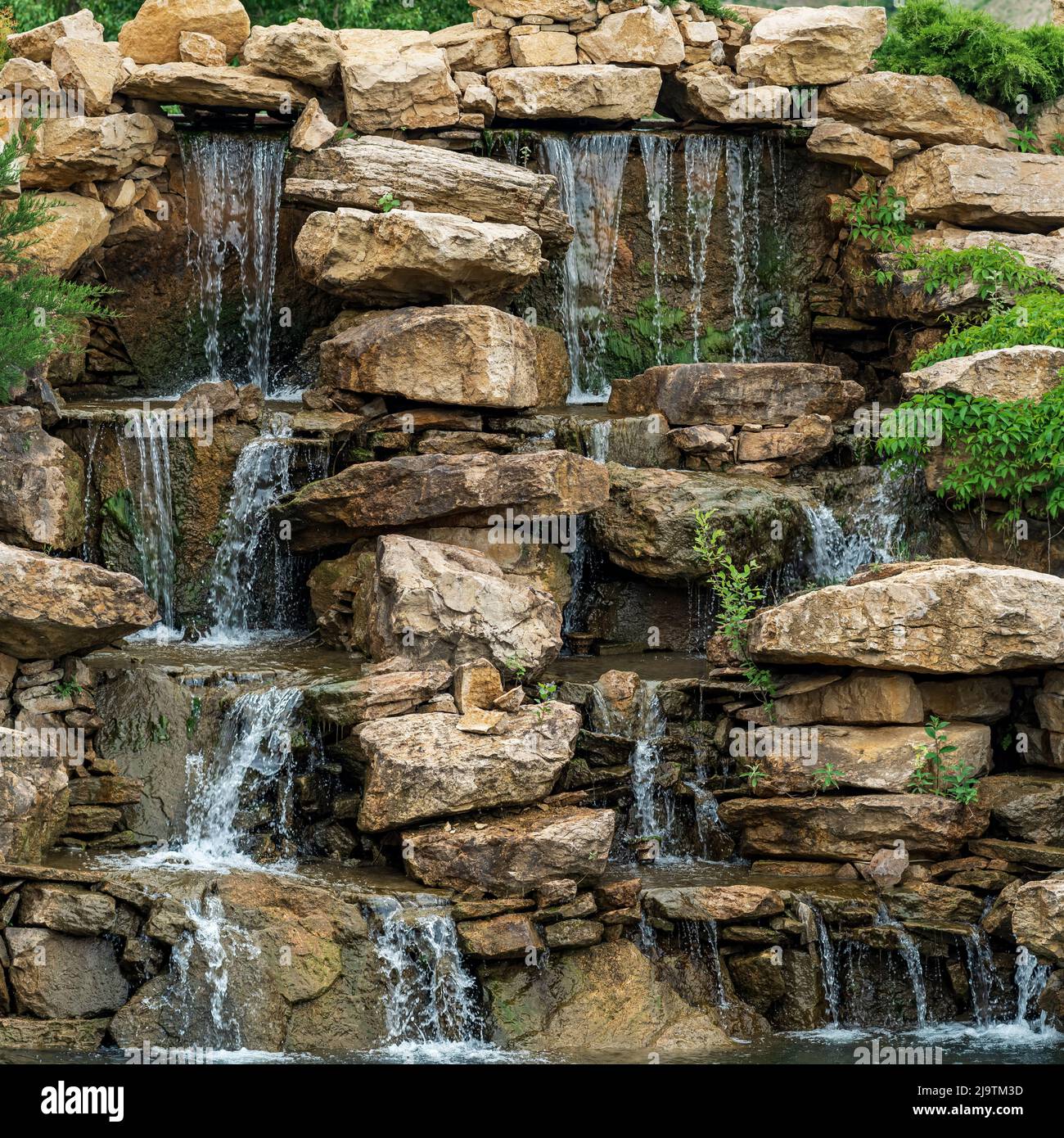 landscape design, a dam with a cascade of waterfalls in the form of ...