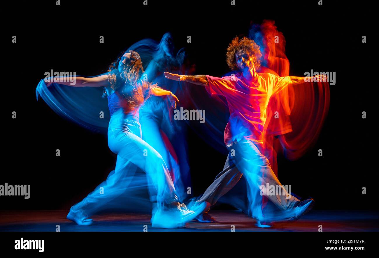 Dance show. Flexible man and girl, hip-hop dancers in motion and action ...
