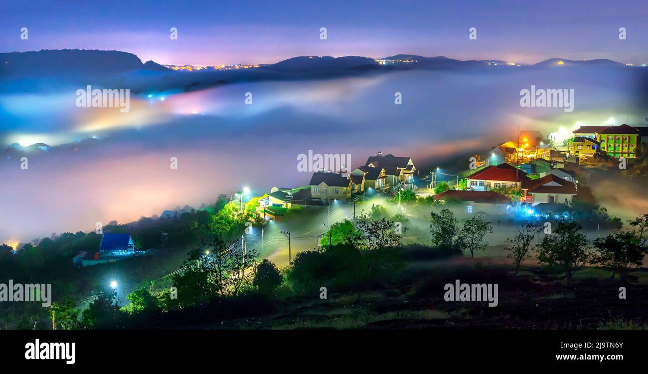 The evening landscape in the valley falling asleep with fog covered is ...