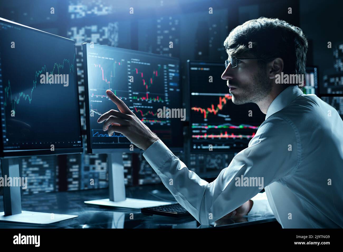 financial analyst pointing at the computer monitor Stock Photo - Alamy