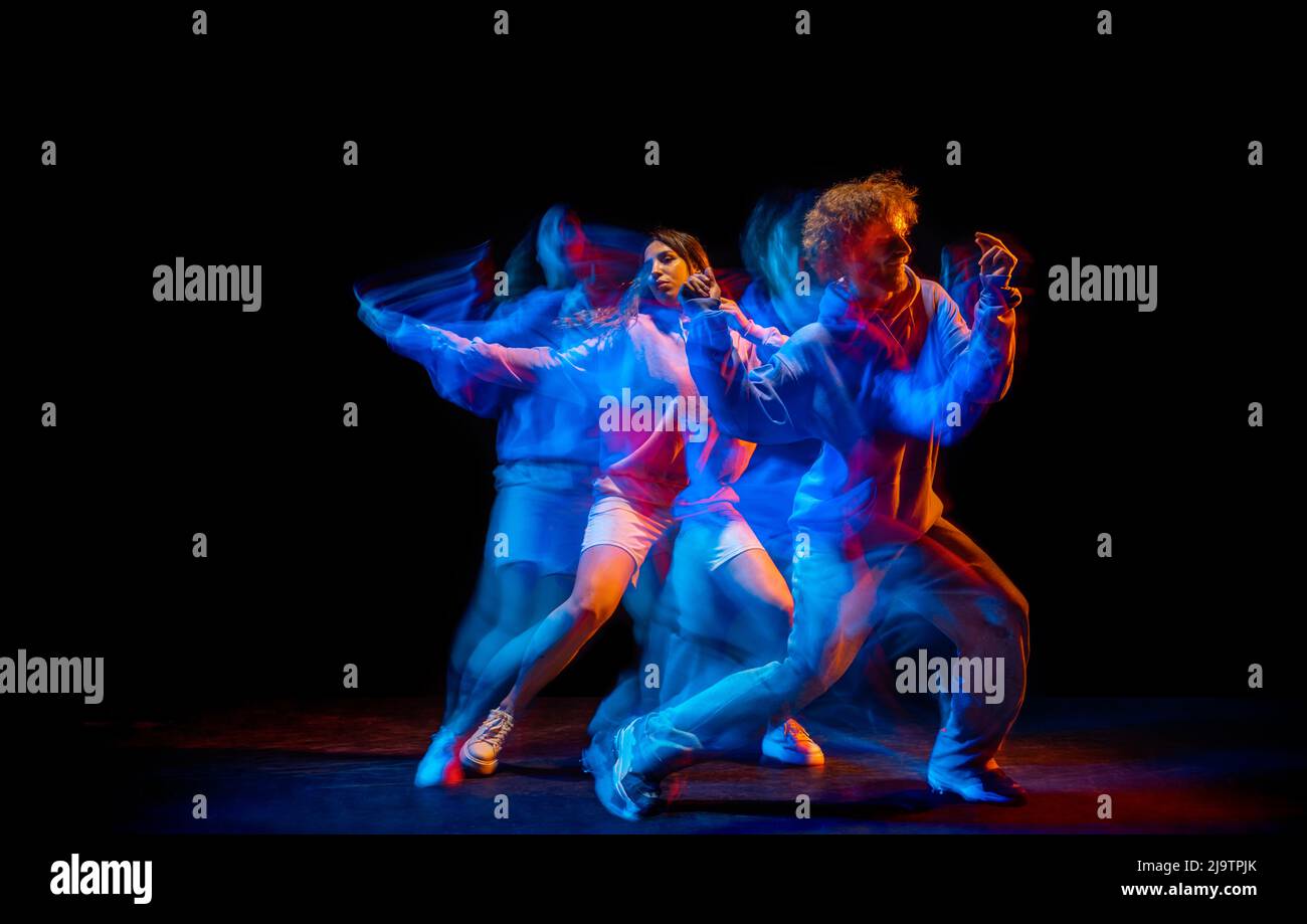 Dance show. Flexible man and girl, hip-hop dancers in motion and action ...