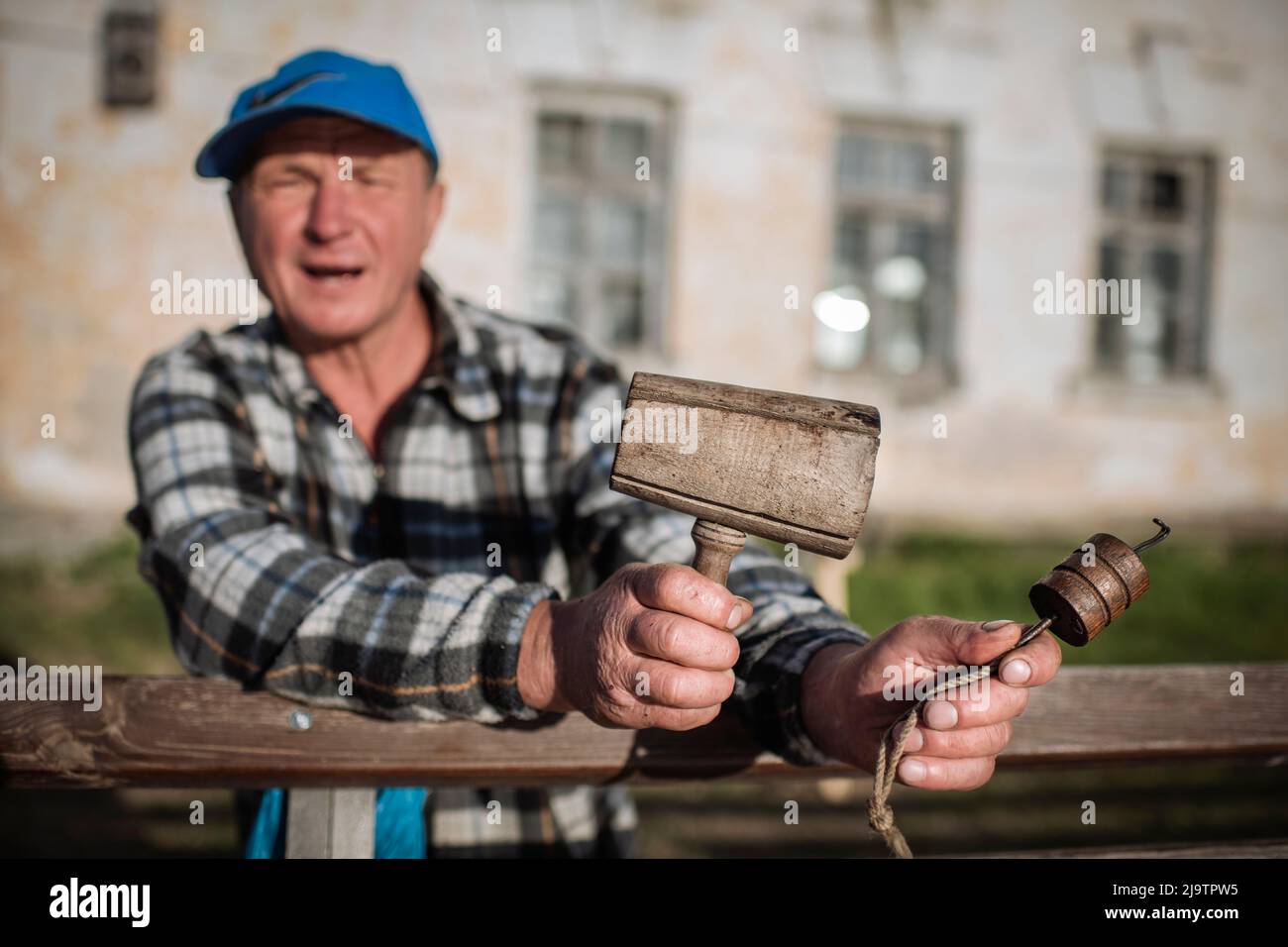 A local resident shows traditional rope weaving tools in Vylkove, Odesa ...
