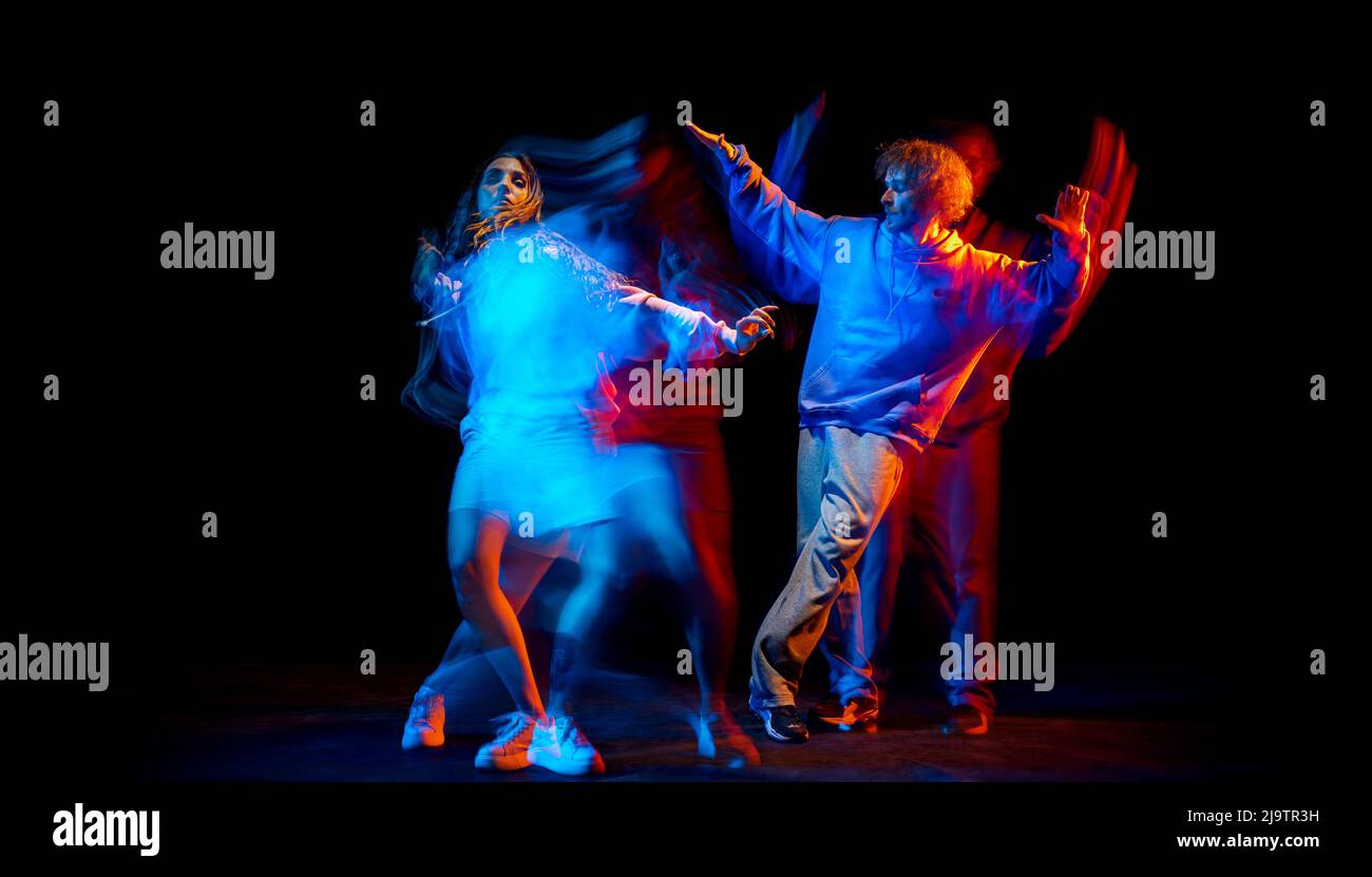 Dance show. Flexible man and girl, hip-hop dancers in motion and action ...