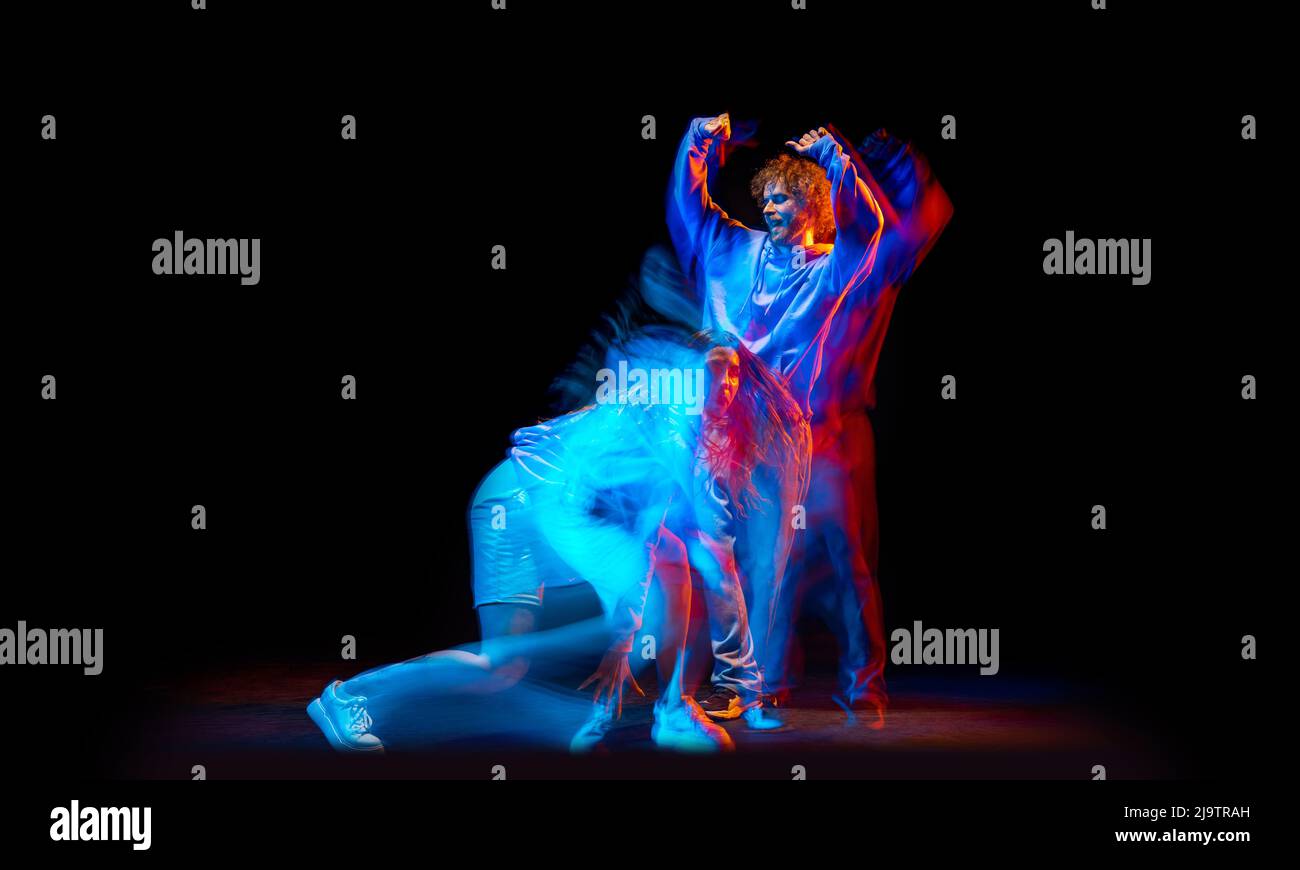 Dance show. Flexible man and girl, hip-hop dancers in motion and action ...