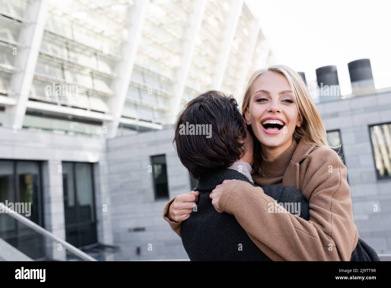 Stylish couple laughing embracing hi-res stock photography and images ...