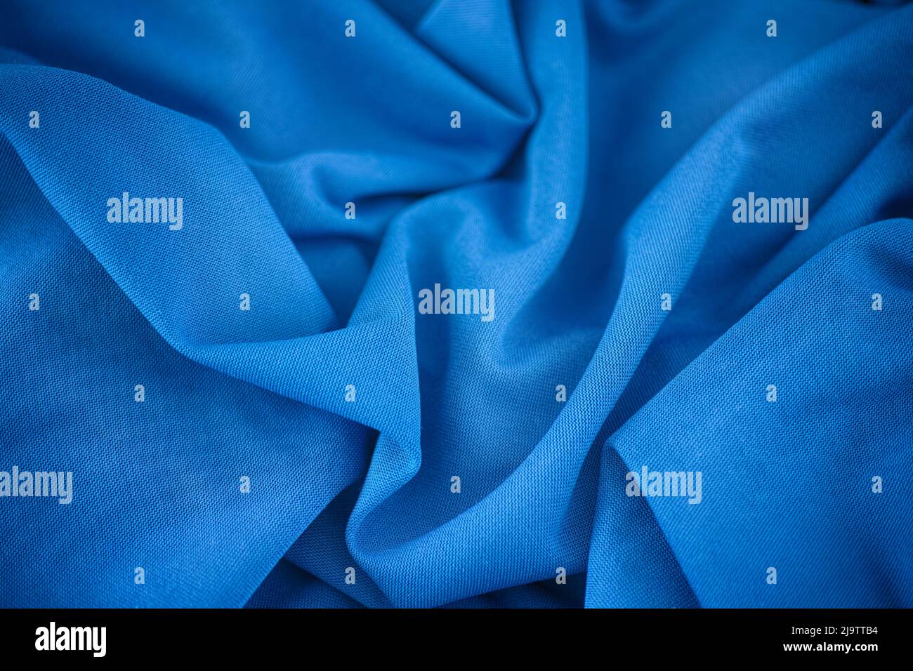 A blue crumpled fabric texture background. Close up Stock Photo - Alamy