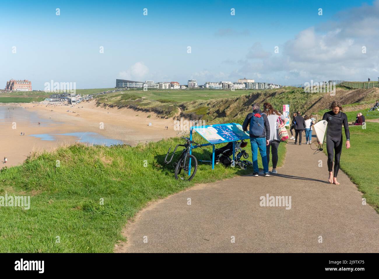 Visitors enjoying the afternoon Autumn sunshine on the footpath ...