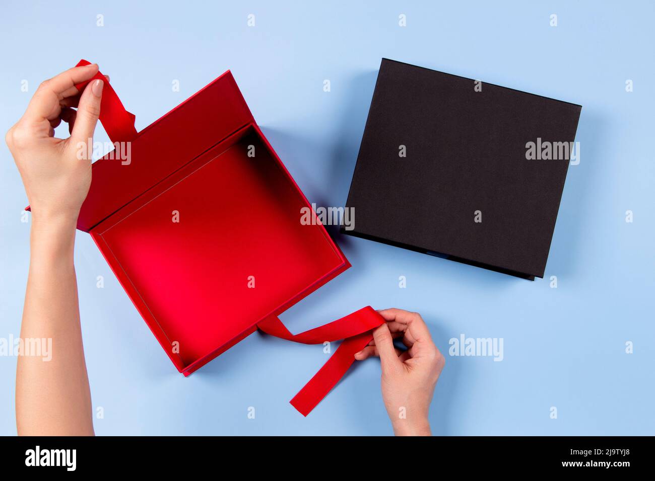 Black female hand opening boxes hi-res stock photography and images - Alamy
