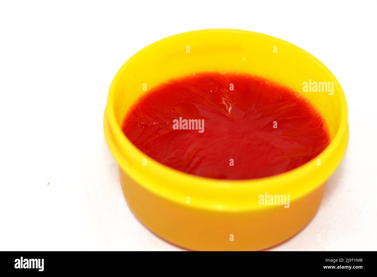 A close up of a delicious sweet red jelly pudding strawberry flavored ...
