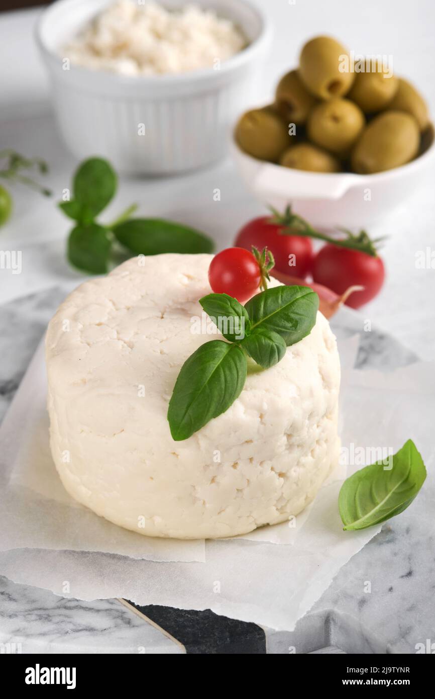 Ricotta cheese. Homemade Ricotta cheese with basil, garlic, tomatoes ...