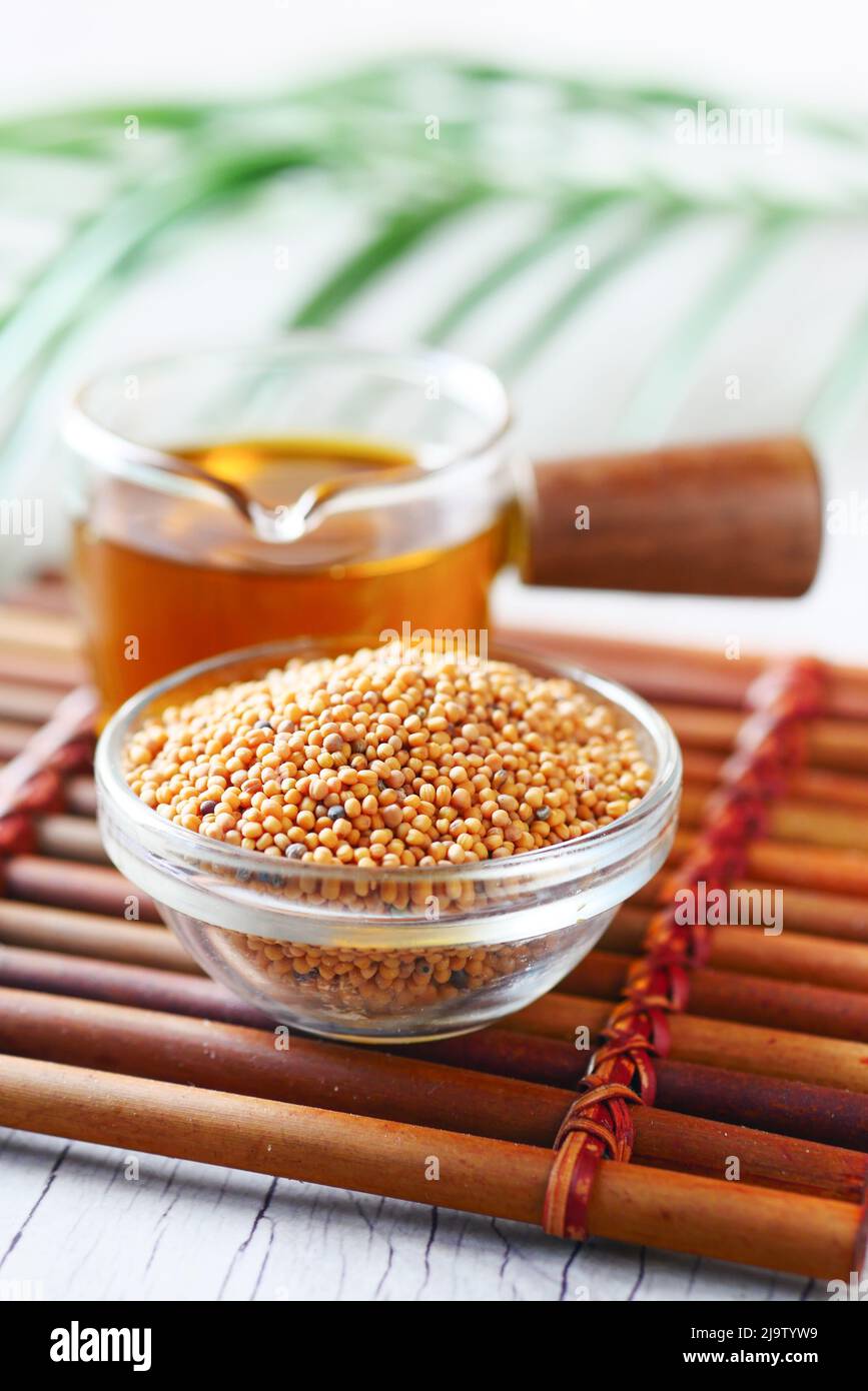 sunflower coking oil and seeds in a container on table Stock Photo - Alamy